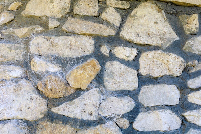 Rough Texture Wall Made of Blocks of Natural Stone. Background or ...