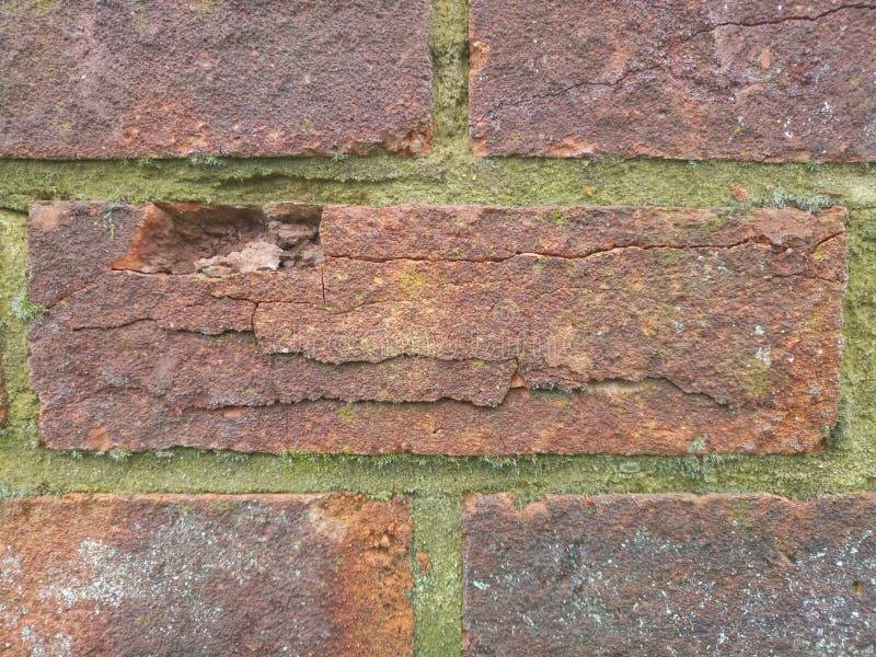 Chipped brick on a wall stock image. Image of brick - 106836035