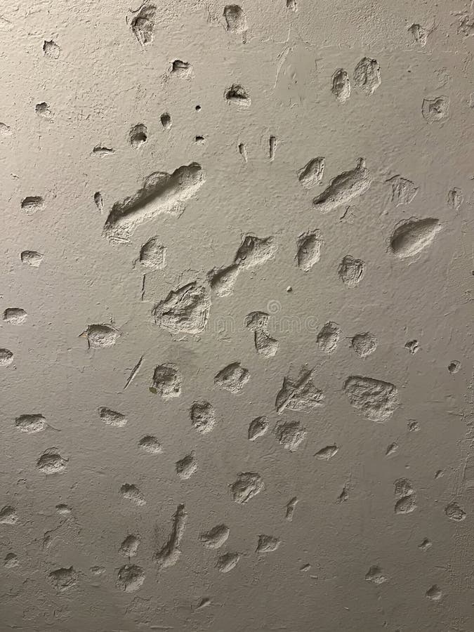 Rough Textured Plaster Wall with Scattered Bumps Stock Photo - Image of ...
