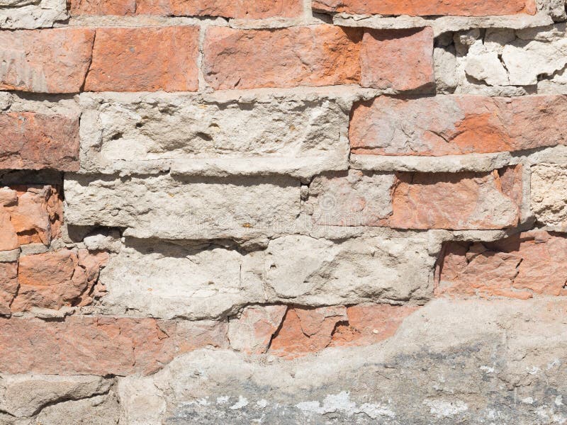 Rough wall with red bricks stock image. Image of building - 74831641