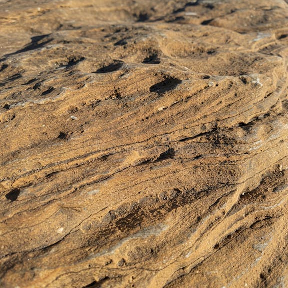 Rough, Weathered Surface of a Rock with Distinct Linear Patterns and ...