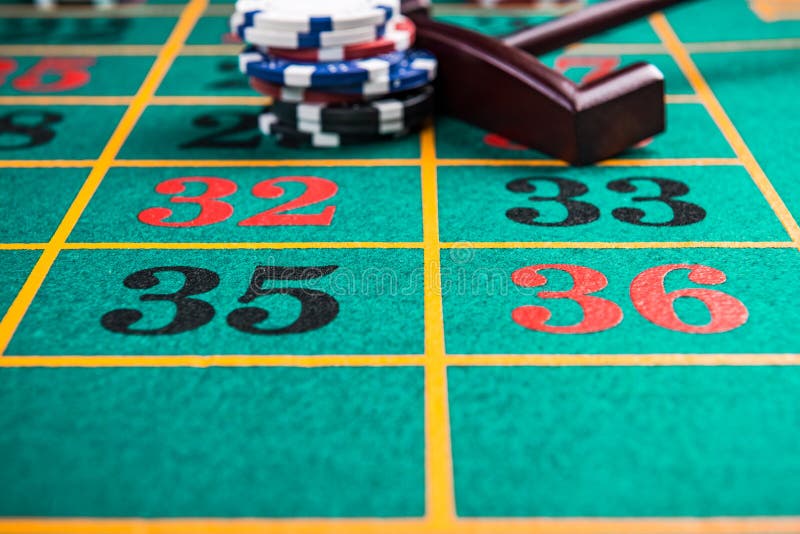 Poker or Roulette Casino Chips Close Up on Green Felt Casino Table ...