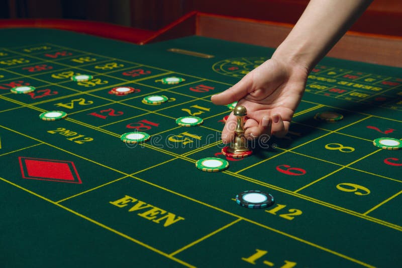 Roulette Table with Chips. Hand of Croupier with Dolly Stock Photo ...