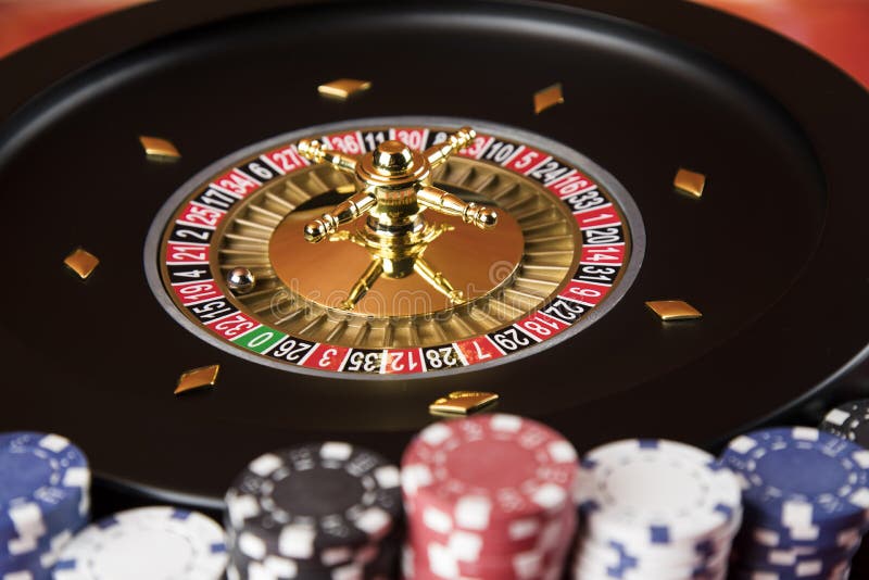Roulette Wheel Running in a Casino, Poker Chips Stock Image - Image of ...