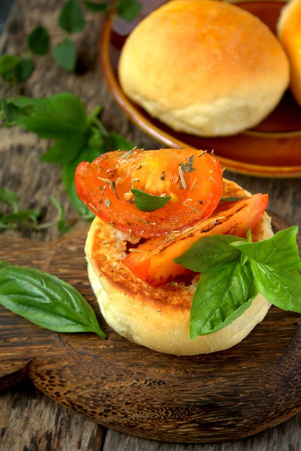 Rounb Bun and Tomatoes Grill Stock Photo - Image of round, lunch: 59811200