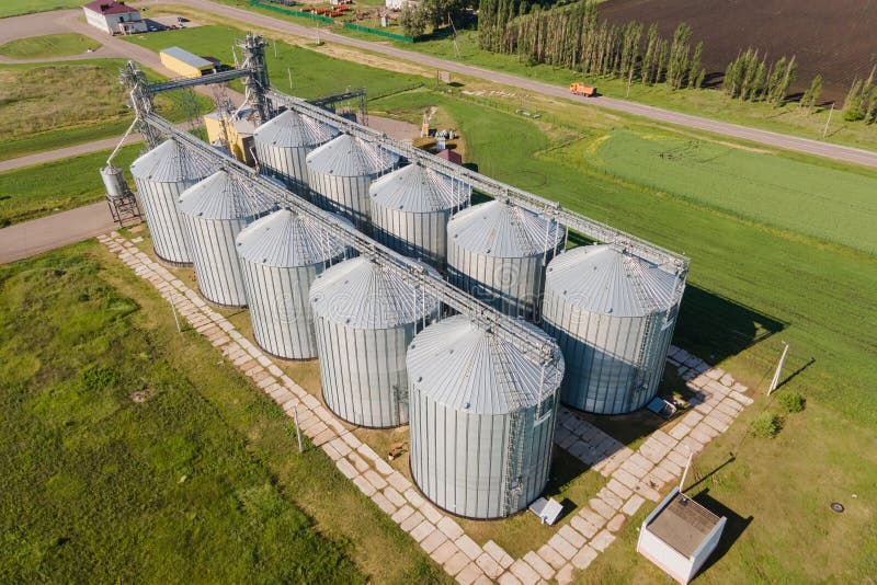 Round Aluminum Granaries. Large Silver Bins for Processing Grains Stock ...