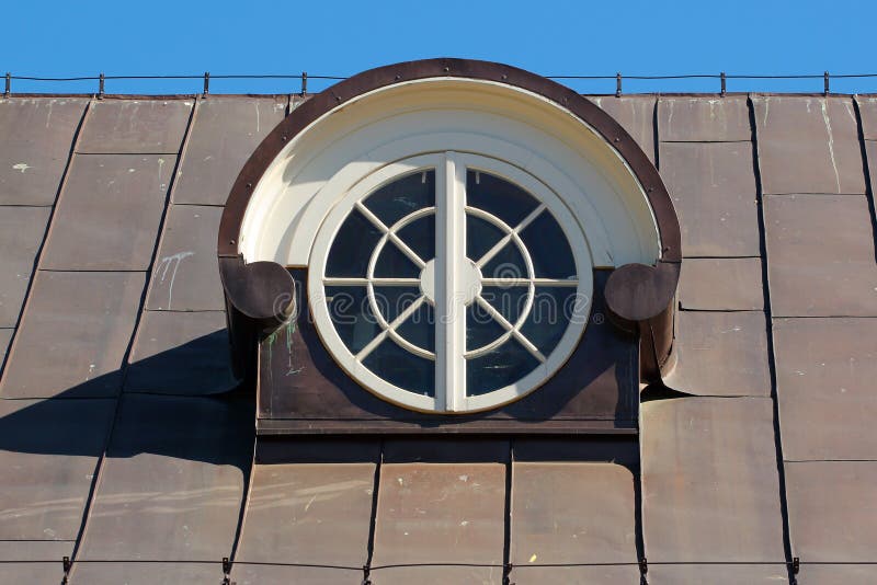 Round Attic Window in a Metal Covered Roof Stock Photo - Image of color ...