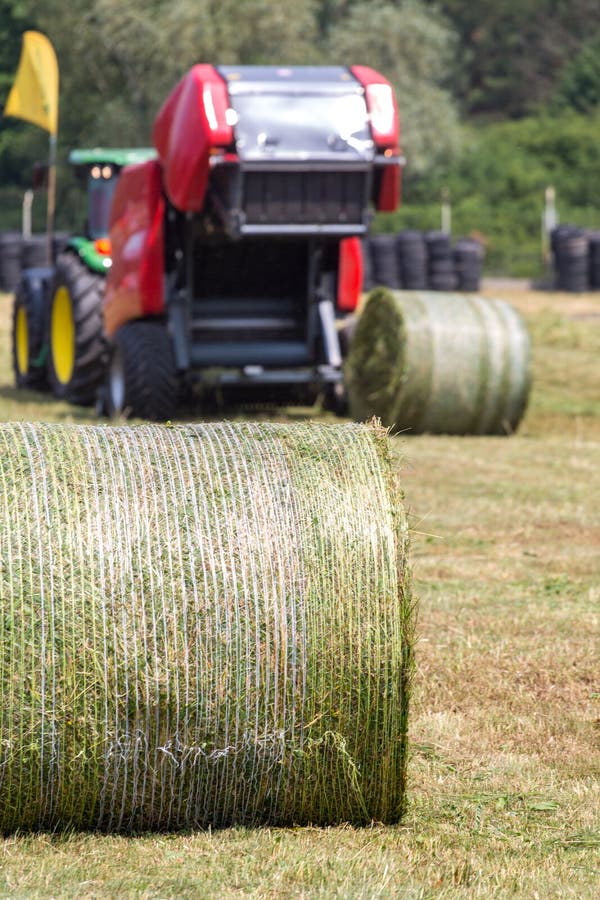 Round baler stock photo. Image of harvested, working - 60242662