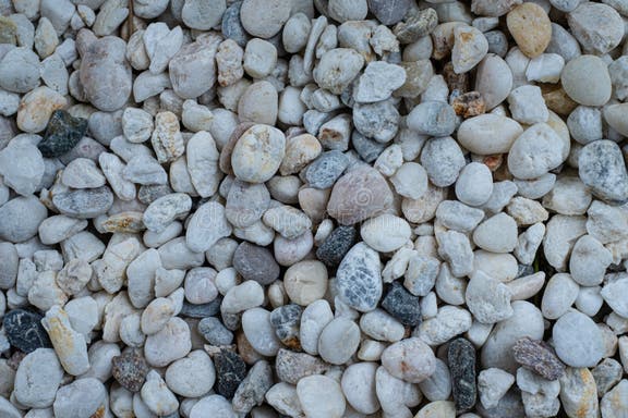 Round Beach Pebbles Create a Natural Stone Wall Texture Stock Image ...