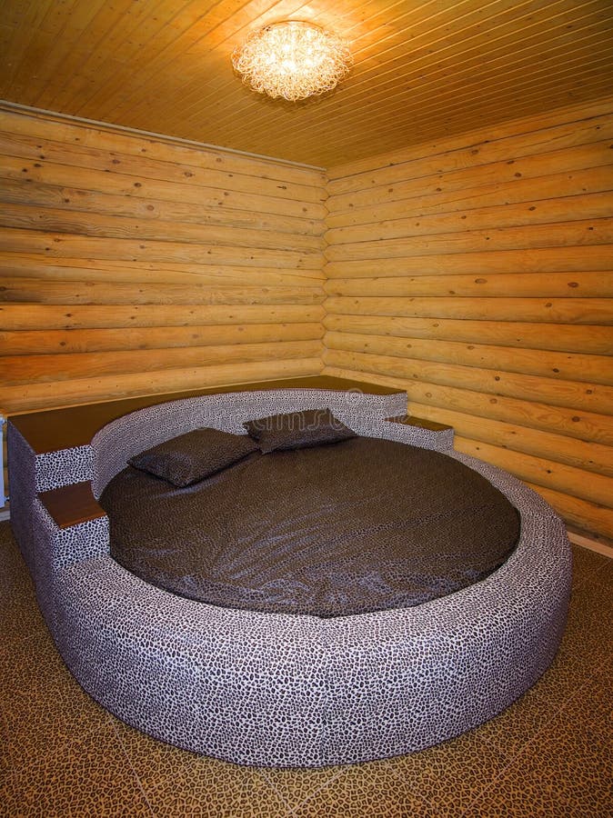 Round Bed in a Wooden Bedroom Stock Image - Image of beautiful ...