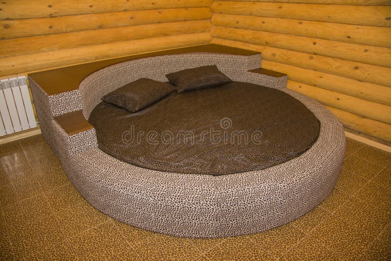 Round Bed in a Wooden Bedroom Stock Image - Image of hotel, interior ...