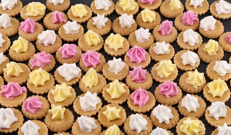Round Biscuits with Cream of Different Colors on the Tops. Stock Image ...