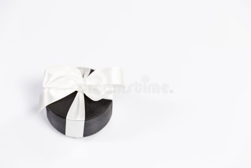 Round Black Gift Box with a White Bow on a White Background. Postcard ...