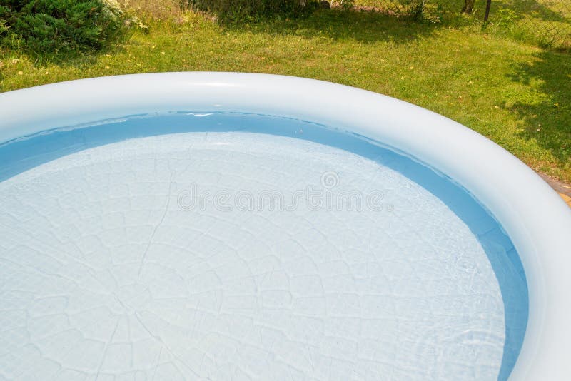 A Round, Blue, Garden Pool for Children. Stock Image - Image of grass ...