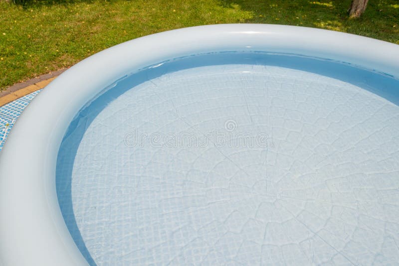 A Round, Blue, Garden Pool for Children. Stock Photo - Image of ...