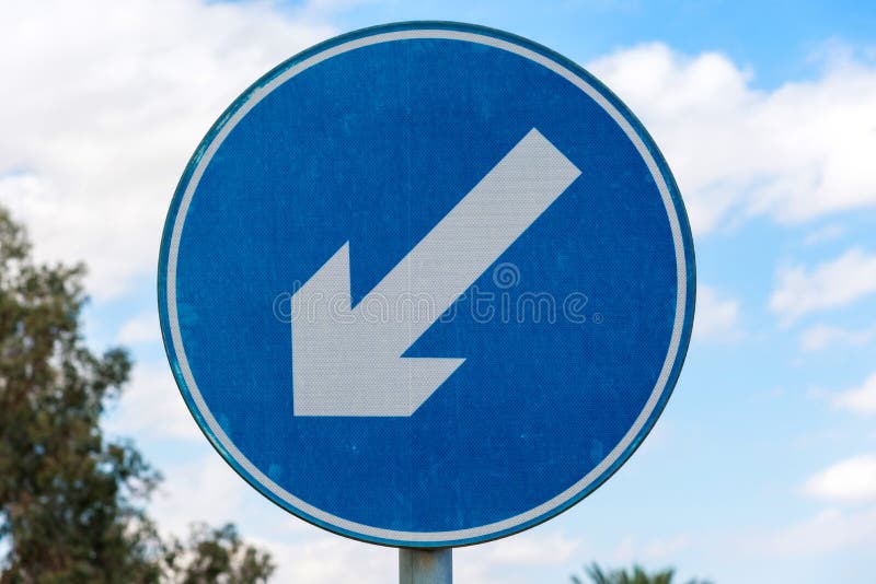 Round Blue Road Sign with White Diagonal Warning Arrow. Horizontal ...