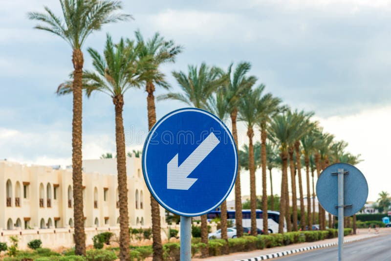Round Blue Road Sign with White Diagonal Warning Arrow. Horizontal ...