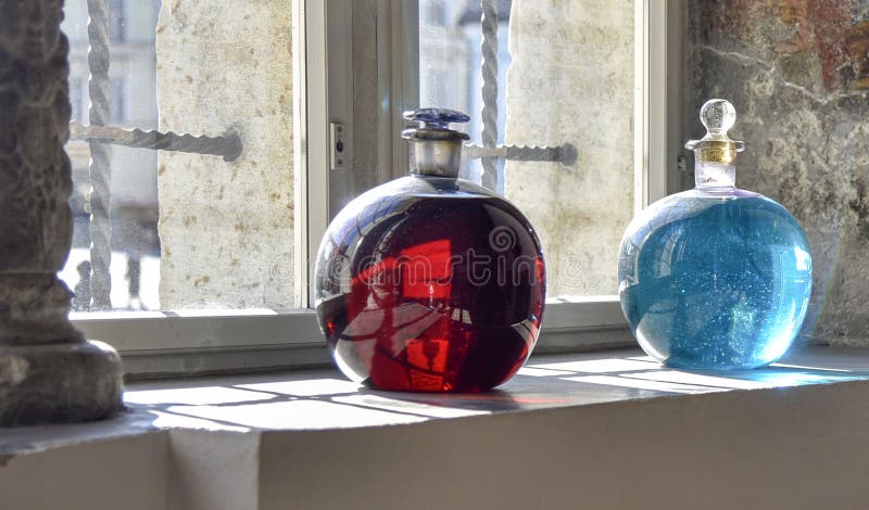 Round Bottle, Flask with Blue Liquid on the Window Stock Image - Image ...