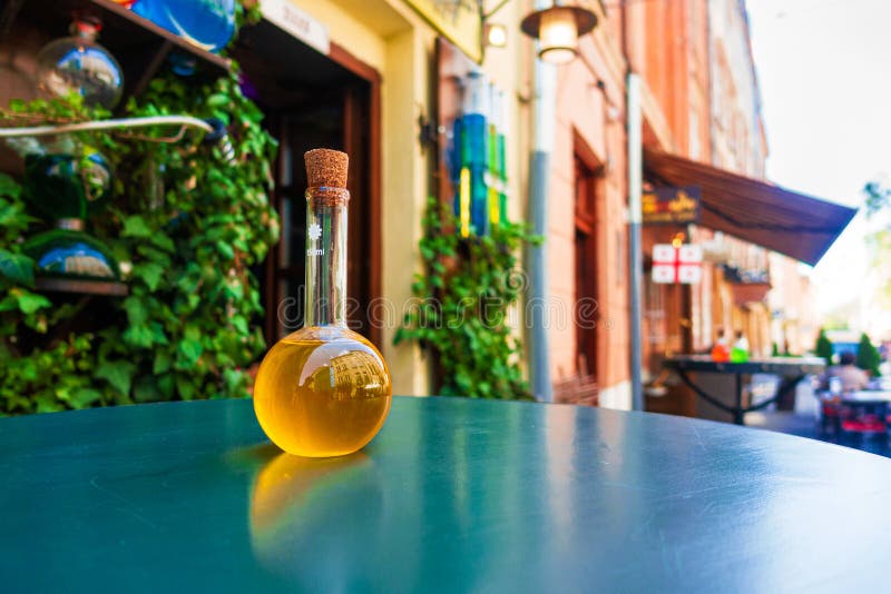 Round Bottle with Olive Oil on the Table of a Street Cafe Stock Photo ...