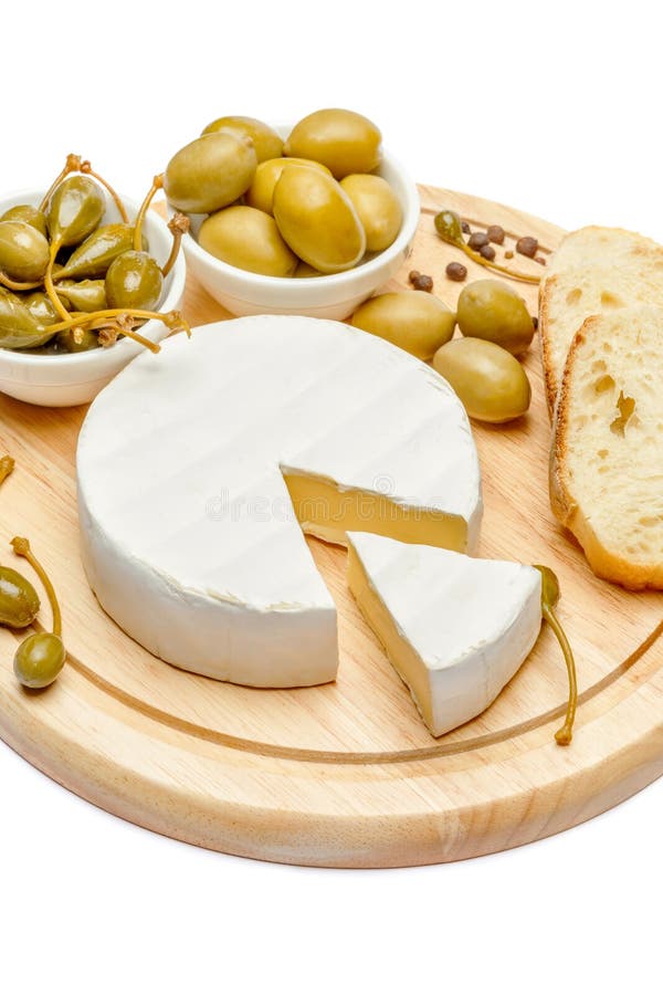 Round Brie or Camambert Cheese on Cutting Board White Background Stock ...