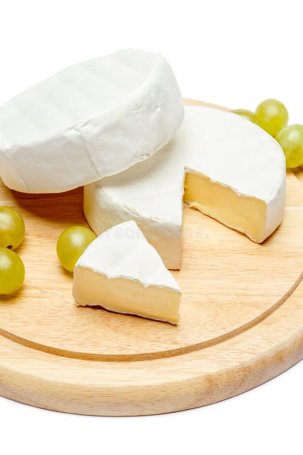 Round Brie or Camambert Cheese on Cutting Board White Background Stock ...