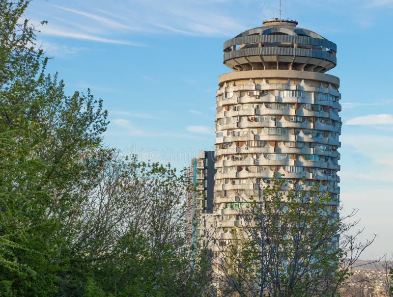 A Round Building in the Blue Sky Surrounded by Trees Stock Photo ...