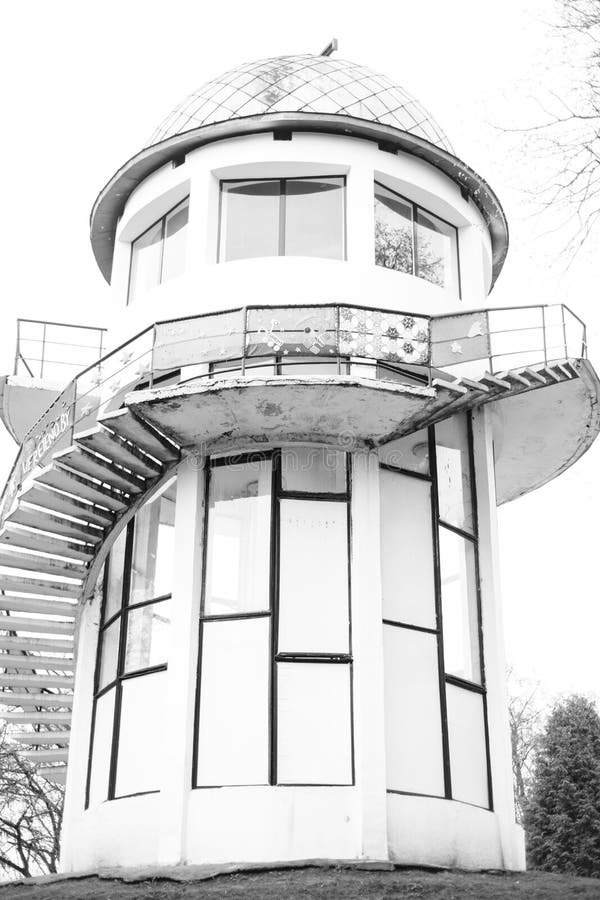 A Round Building with Large Windows and a Staircase Around Stock ...
