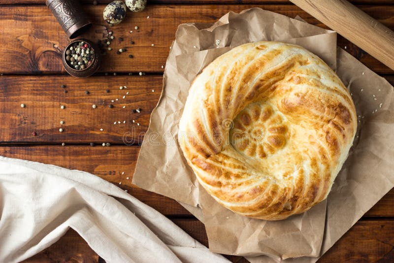 Round Cake of Bread on a Wooden Table with Spices, Home-made Bread ...