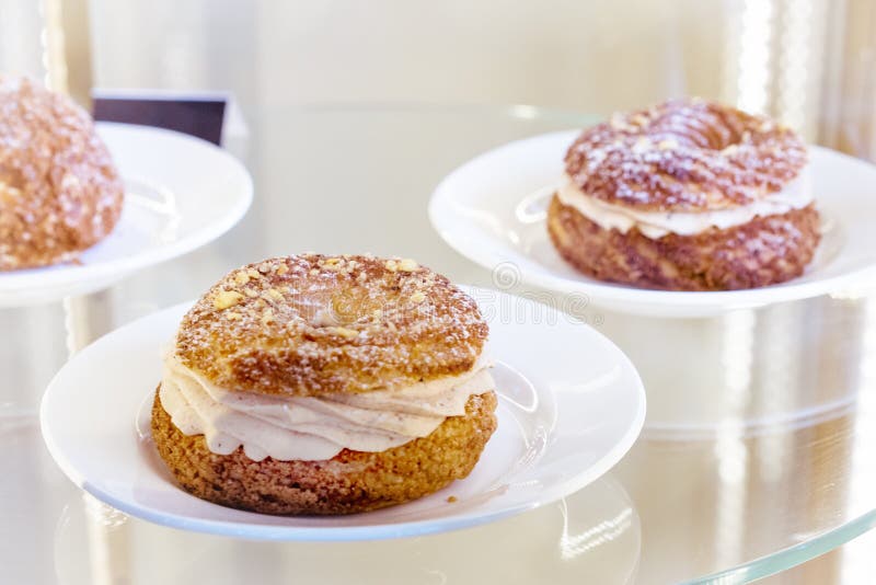Round Cake Eclair Stuffed with Custard on the Counter at the Coffee ...
