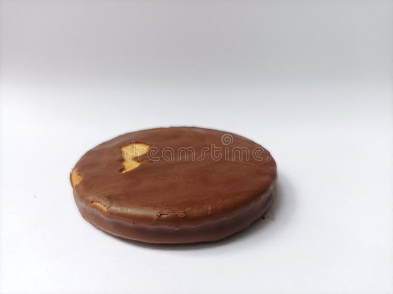 A Round Cake Wrapped in Chocolate with Cream Inside. Stock Image ...