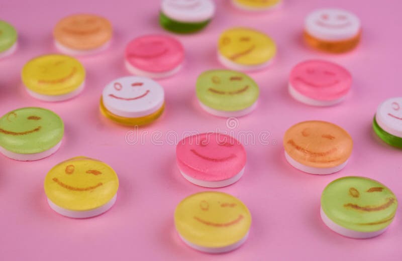 Round Candies with a Painted Smile. Cute Sweets on a Pink Background ...