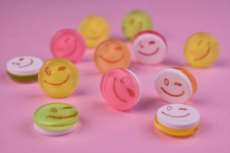 Round Candies with a Painted Smile. Cute Sweets on a Pink Background ...
