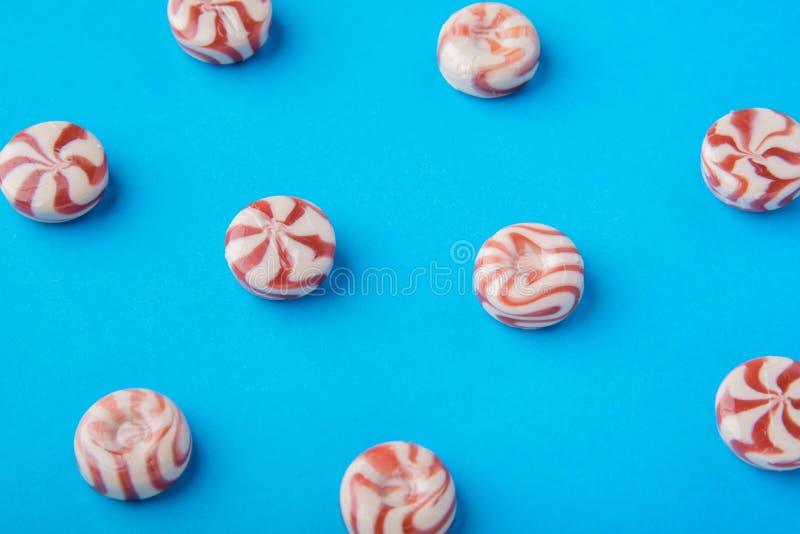 Round Candy Red and White on a Blue Background Stock Photo - Image of ...