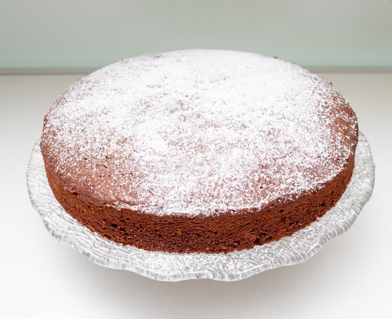 Round Caprese Cake with Icing Sugar on Glass Cake Stand Stock Image ...