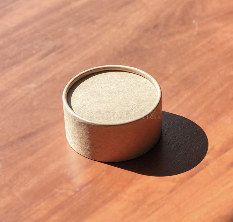 A Round Cardboard Box on the Table. Sunny Morning Stock Photo - Image ...