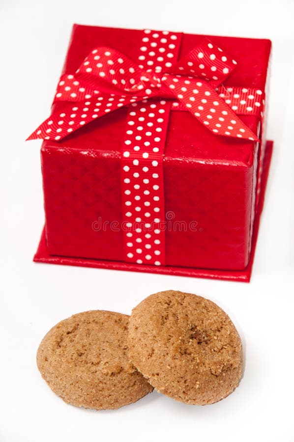 Round Chocolate Cookie and Red Gift Box with Bow Stock Image - Image of ...