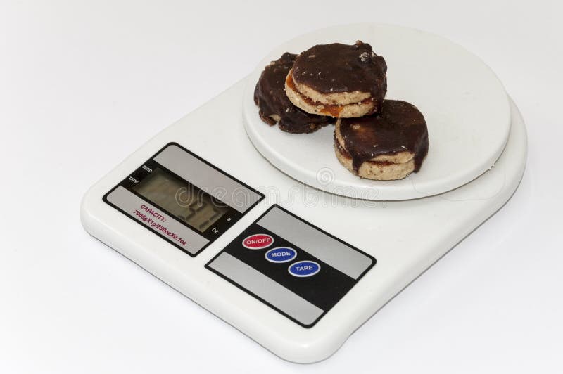 Round Chocolate Cookies on the Kitchen Digital Scale Stock Photo ...