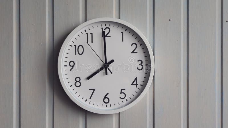 A Round Clock Hangs on a Wooden Wall. the Clock Shows 8 O Clock or 20 O ...