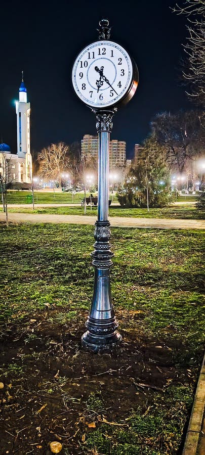 Round Clock on a High Stand in the Town Square. Stock Image - Image of ...