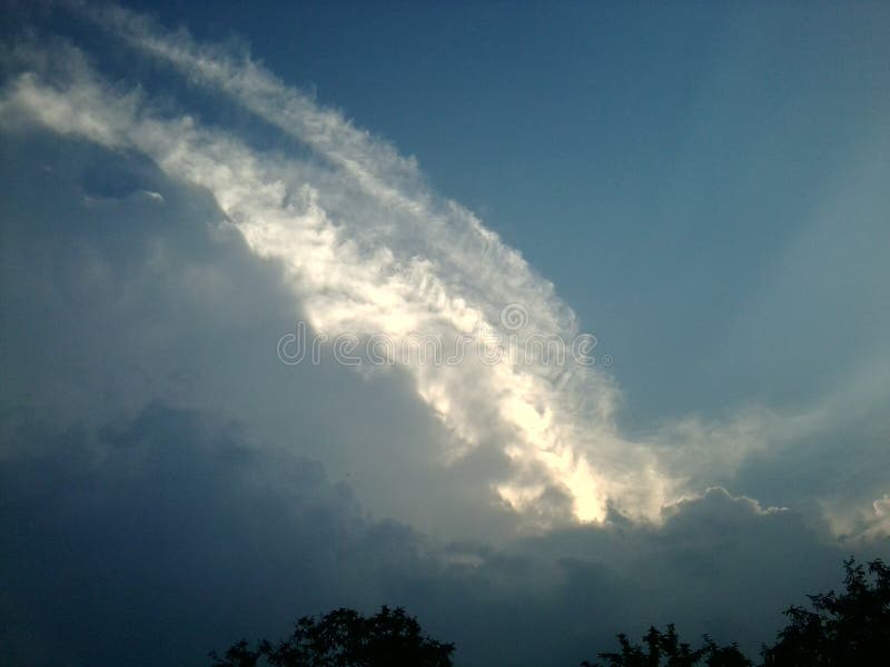 Round Clouds Illuminated by the Sunset Sun Stock Photo - Image of beach ...