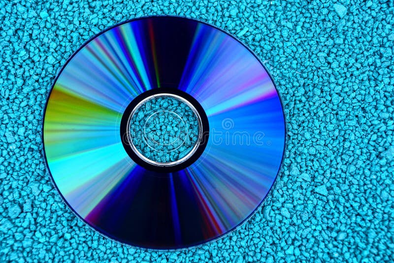 Round Compact Disc on Small Green Stones Stock Photo - Image of disk ...