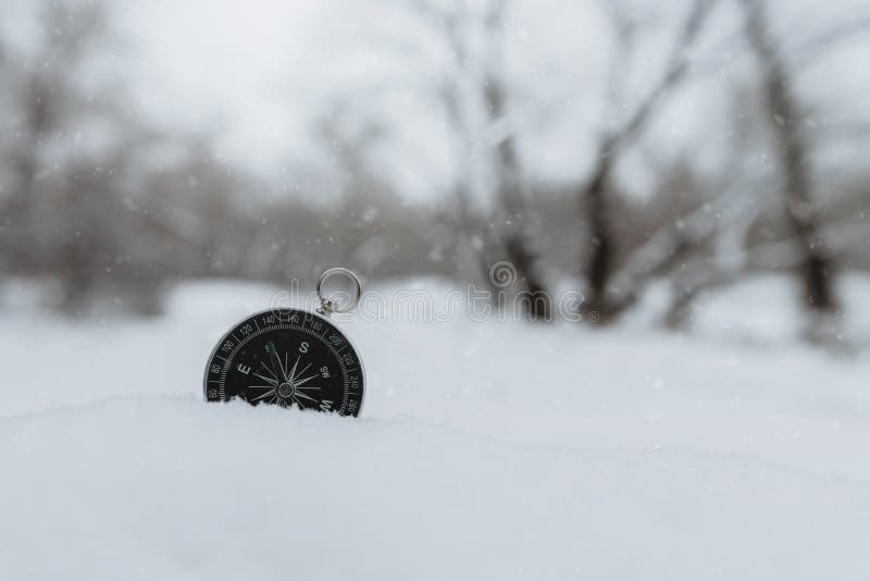 Round Compass in the Snow, Space for Text. Navigation in the Winter ...
