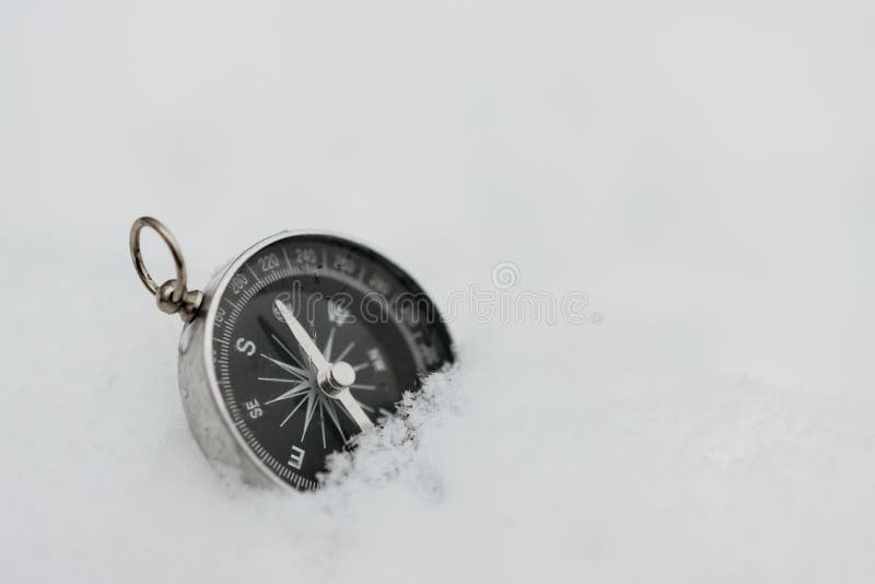 Round Compass in the Snow, Space for Text. Navigation in the Winter ...