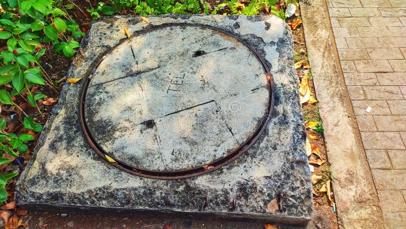 Round Concrete Cover for Telephone Connection Hole at the Edge of the ...