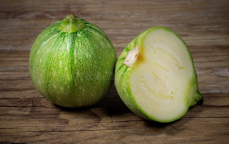 Round Courgettes on Wood Table Stock Photo - Image of round, freshness ...