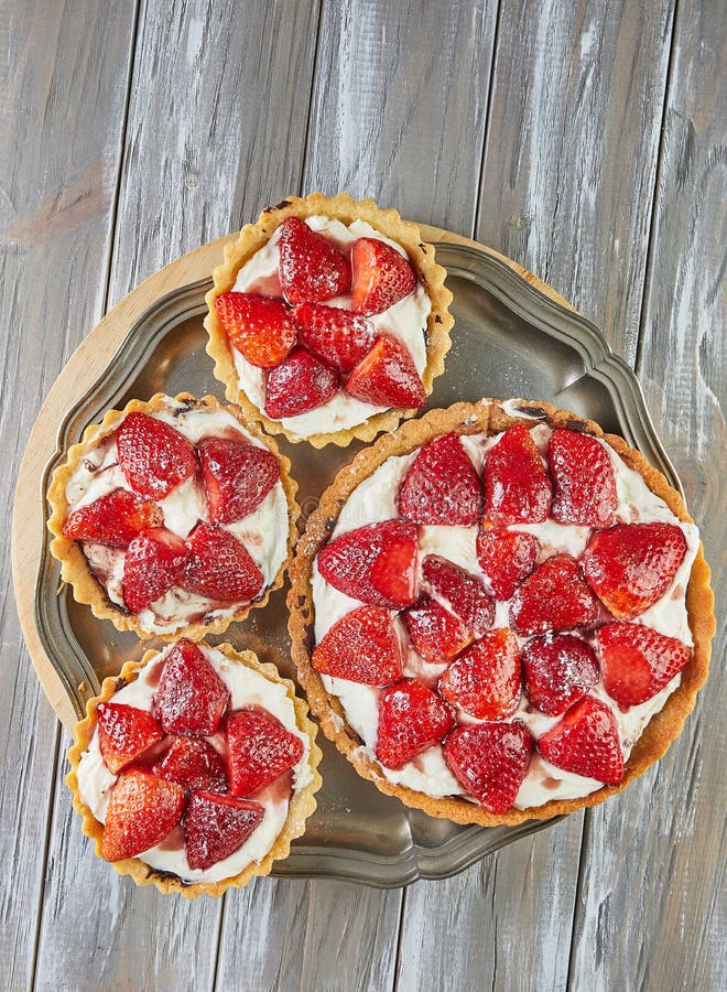 Round Cream Pie with Strawberries. One Big and Three Small Stock Image ...