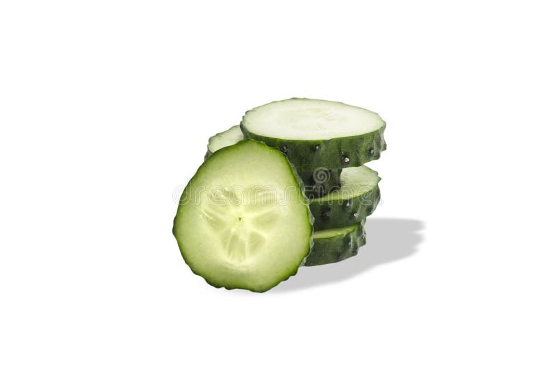 Round Cucumber Slice Close-up Near Stack of Sliced Cucumber Pieces ...