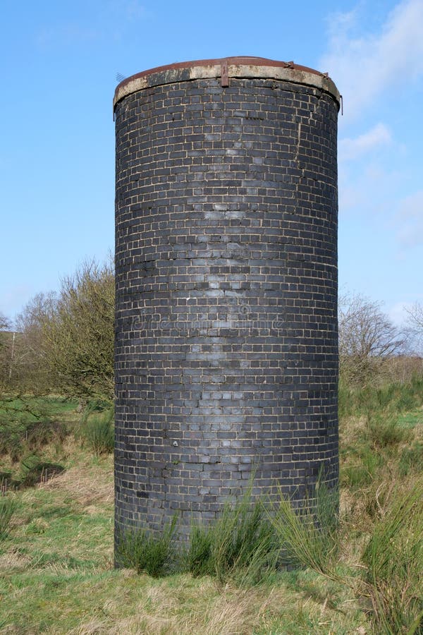 Round Dark Brick Tower on Grass Editorial Image - Image of chimney ...