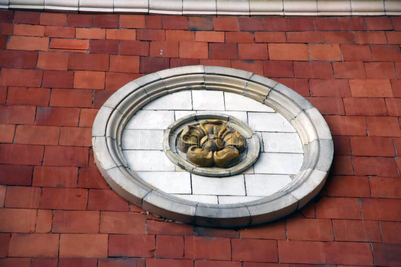 Round Decorative Element in Flower Shape. Red Bricks Wall Stock Image ...