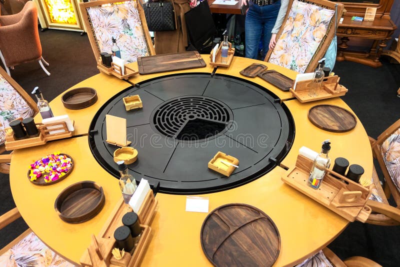 Round Dining Table with Round Grill Inside Stock Image - Image of ...